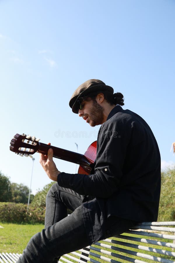 Playing the Guitar Outdoor To Train the Mind for Concentration and ...