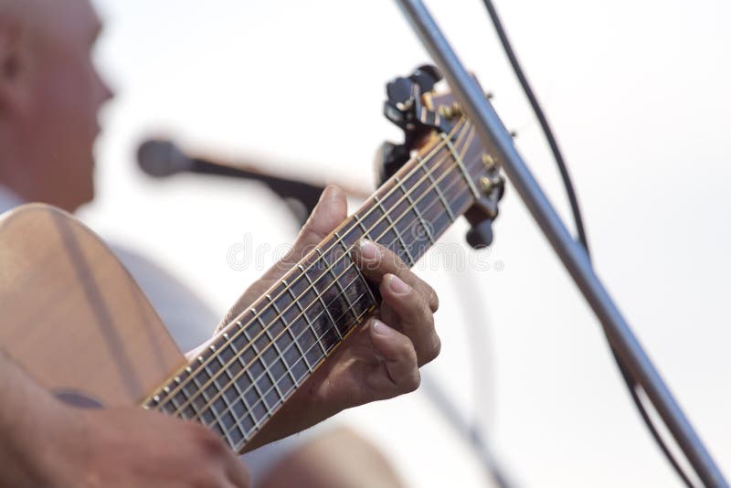 Playing guitar on stage stock photo. Image of musical - 102261210