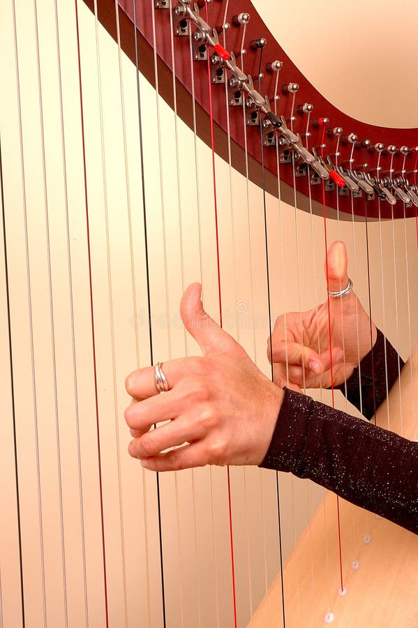 Playing A Harp Picture. Image: 9709927
