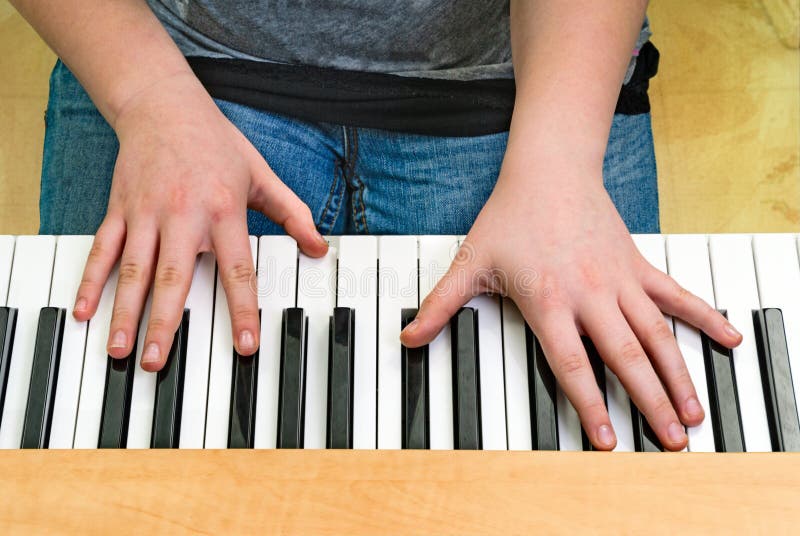 Playing a Keyboard stock image. Image of black, equipment - 25980481