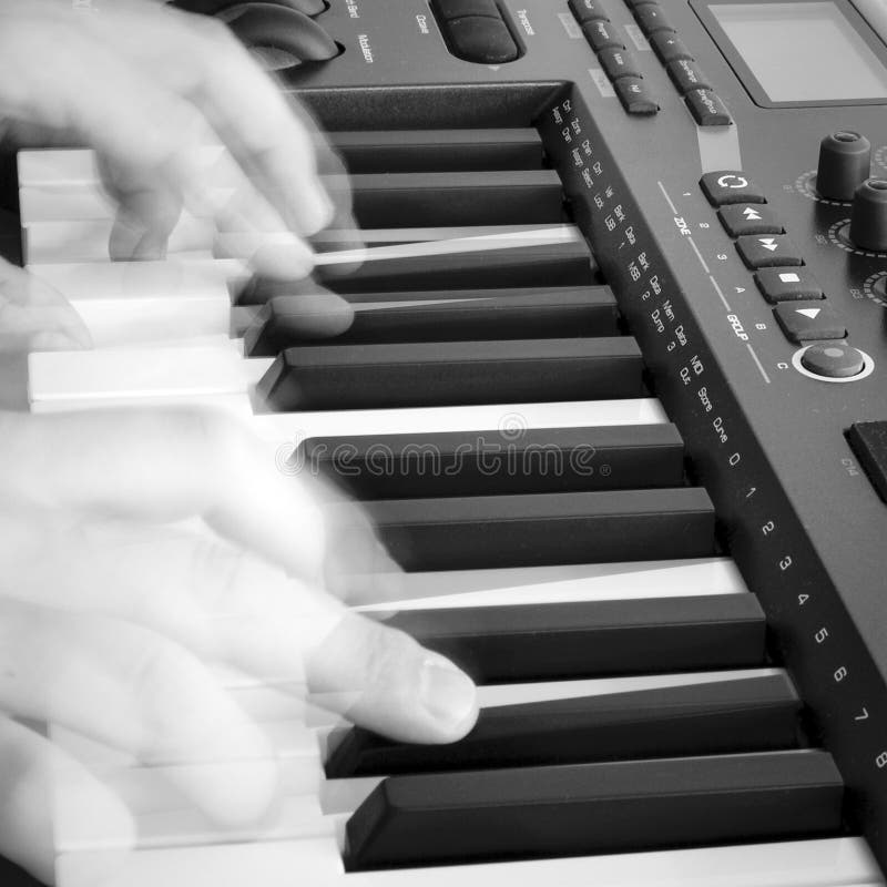 Playing a Keyboard stock photo. Image of solo, white - 28559578