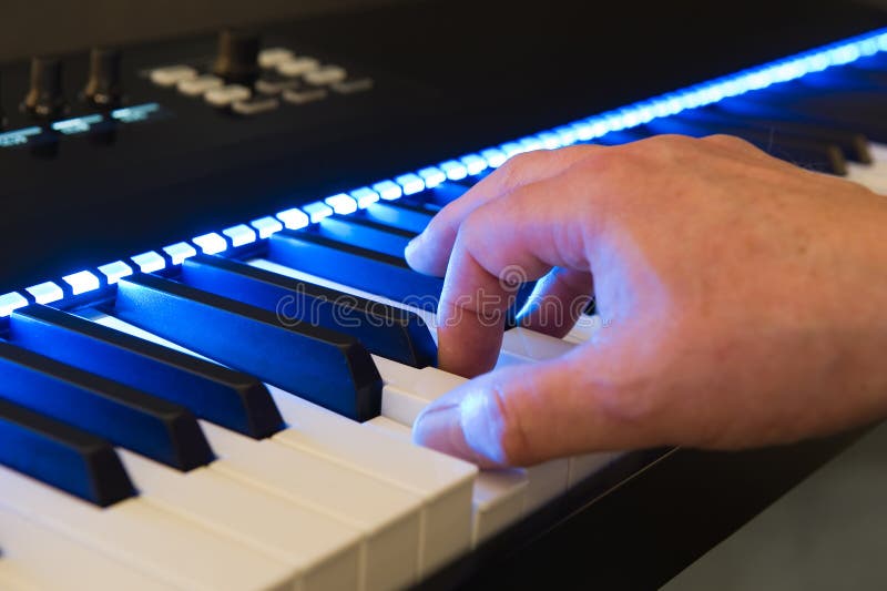 Playing a keyboard stock photo. Image of electronic - 125032972