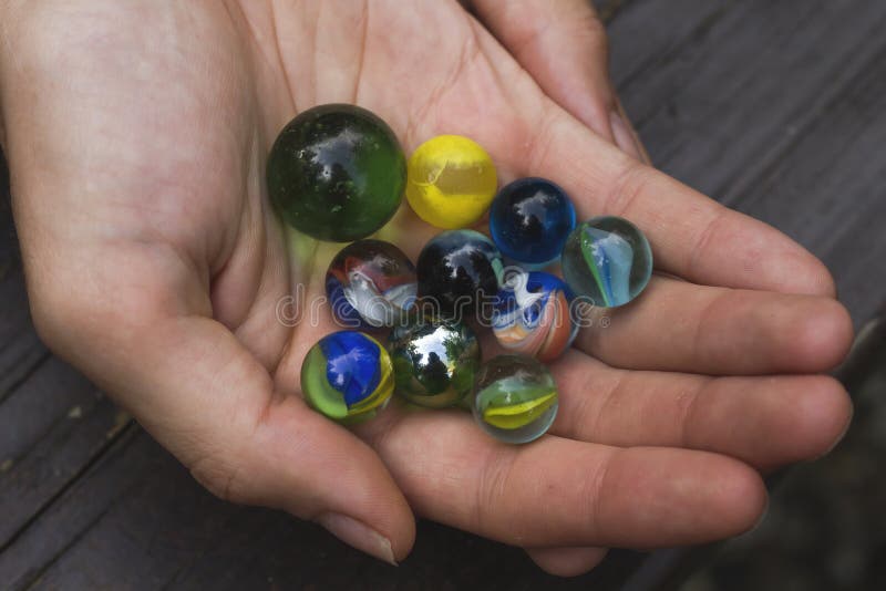 Playing marbles stock image. Image of table, nostalgia - 86688455