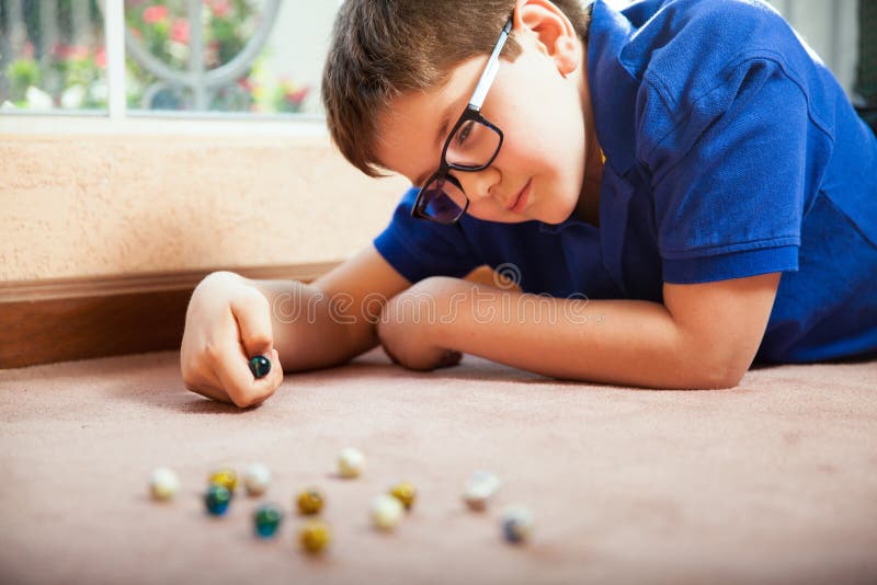 291 Child Playing Marbles Stock Photos - Free & Royalty-Free Stock ...