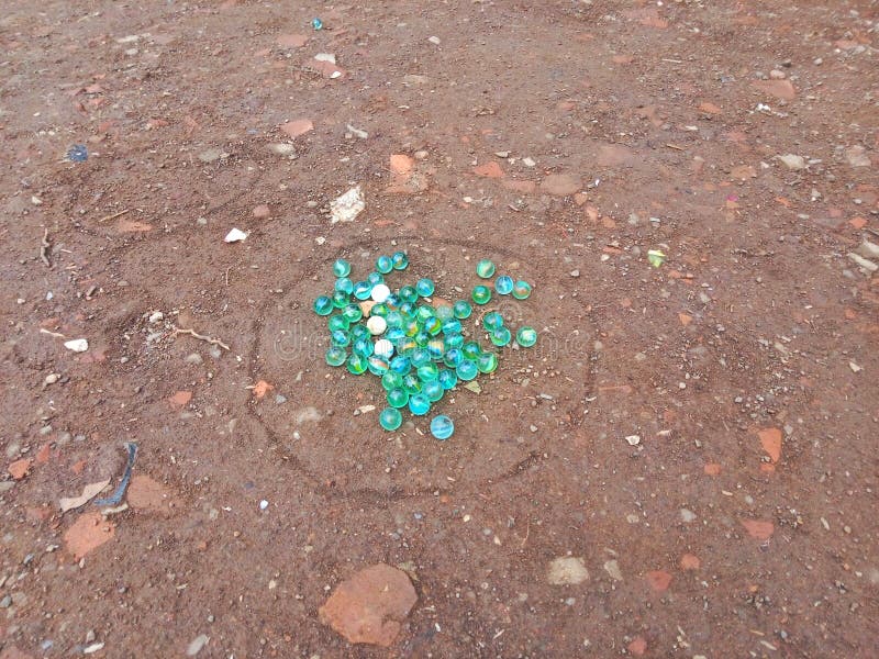Playing Marbles in the Yard Stock Photo - Image of traditional, game ...