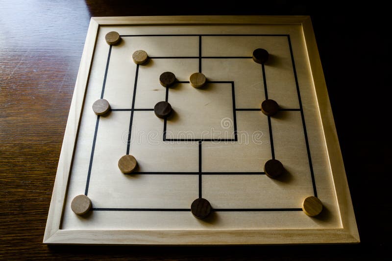 Playing Mill Game on a Wooden Table Stock Photo - Image of nineman ...