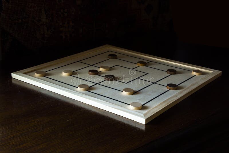 Playing Mill Game on a Wooden Table Stock Image - Image of board ...