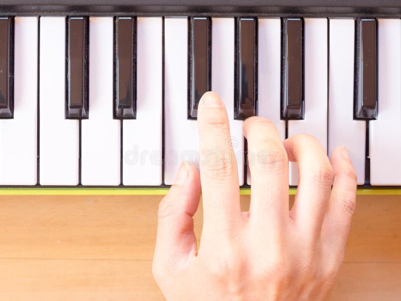 Playing Mini Digital Piano, F Stock Image - Image of black, movement ...