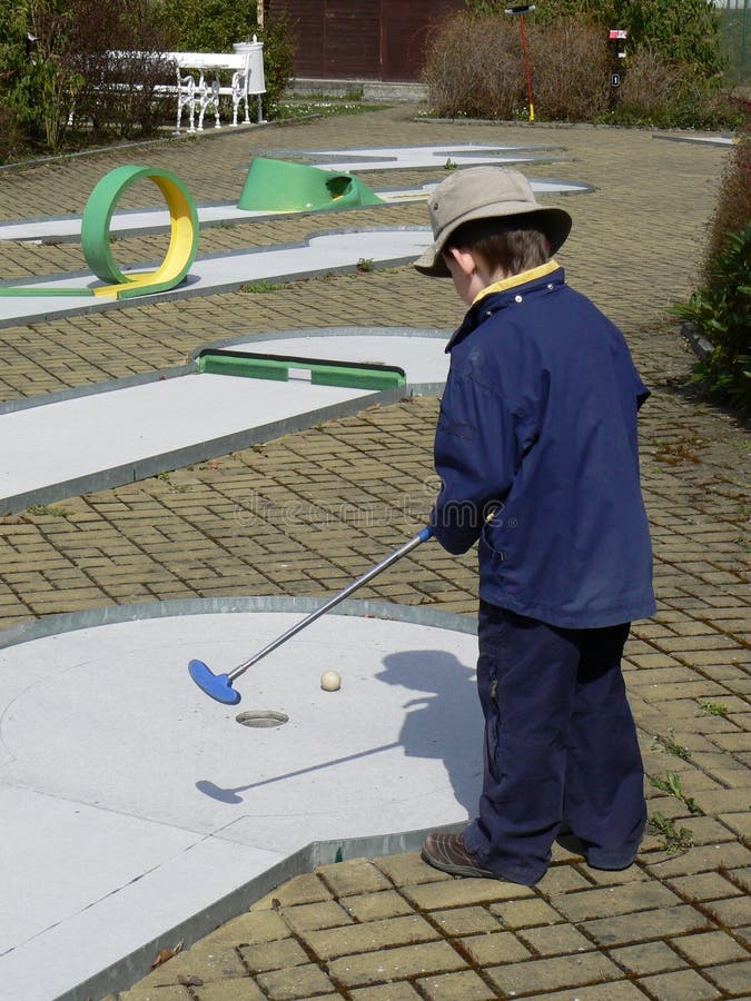 Playing mini-golf stock photo. Image of playground, mini - 4877320