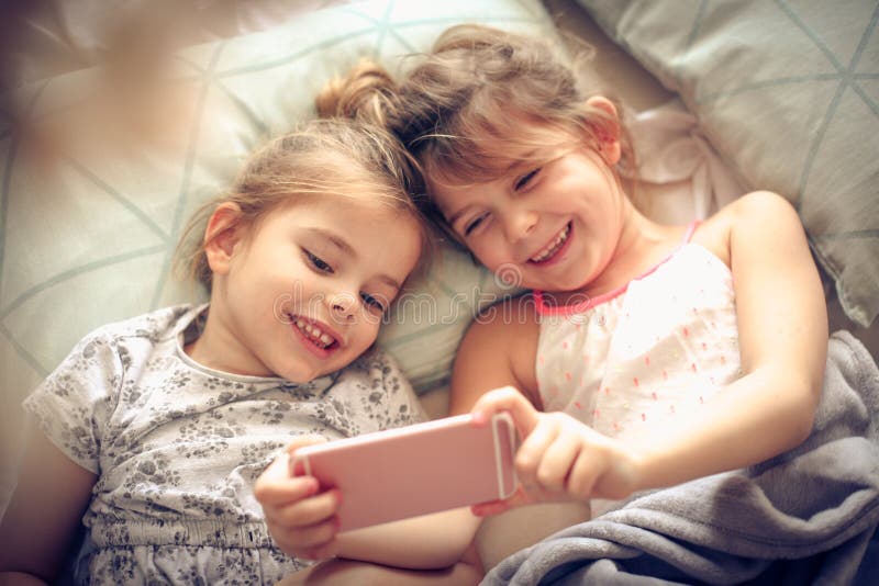 Playing with mobile phone. stock image. Image of childhood - 119963441