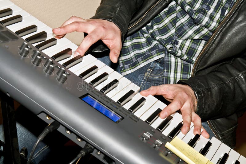 Playing the music keyboard stock image. Image of performing - 19076307