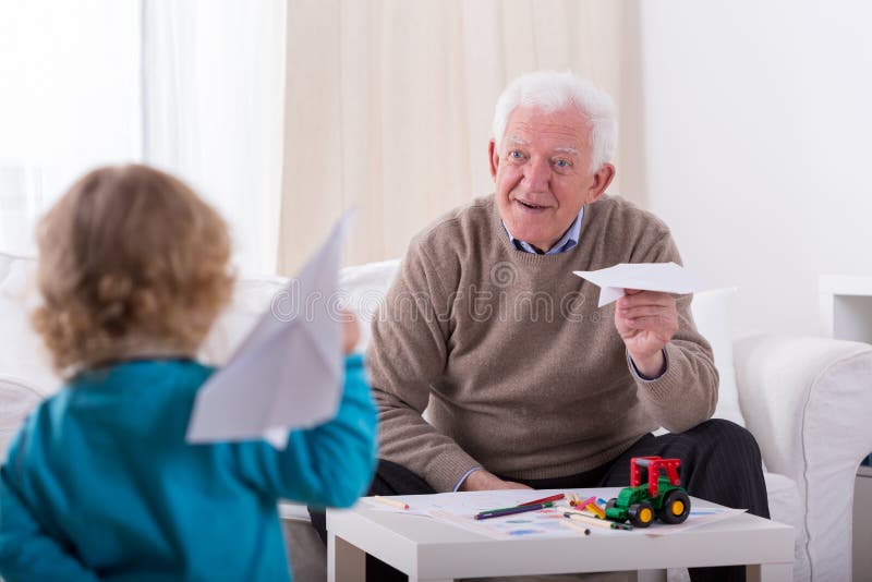 Playing with Paper Airplanes Stock Photo - Image of older, person: 62911276