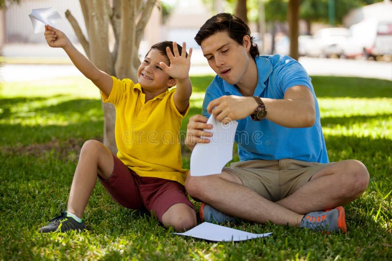 Playing with Paper Planes in a Park Stock Photo - Image of outdoor ...
