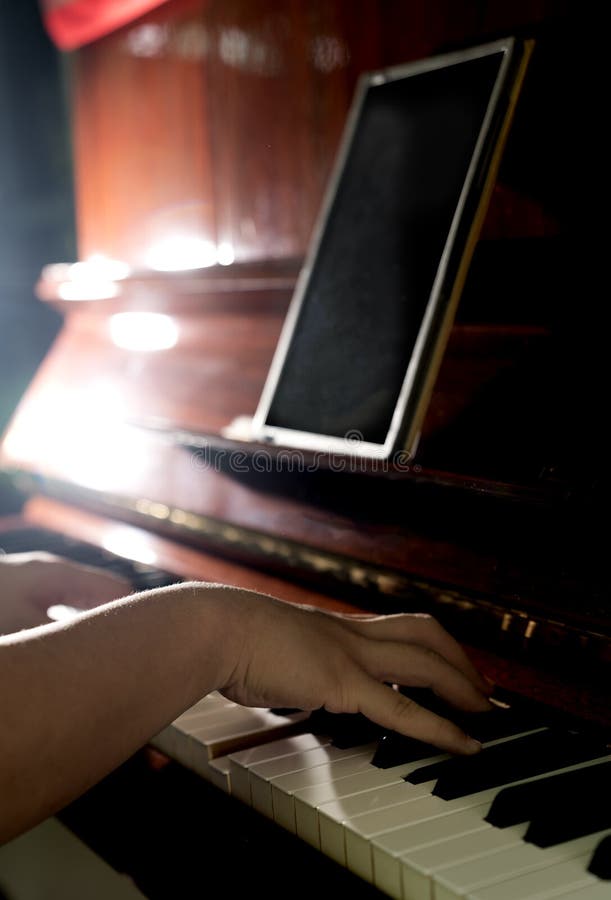 Playing piano with tablet stock image. Image of upright - 108049013