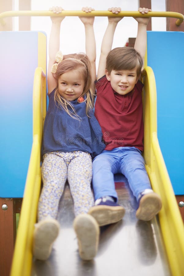 Two Little Friends Playing Together in Playground. Stock Image - Image ...