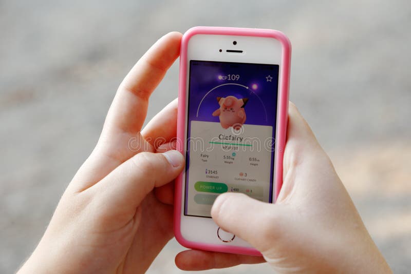 Playing Pokemon Go editorial photo. Image of interface - 75126146