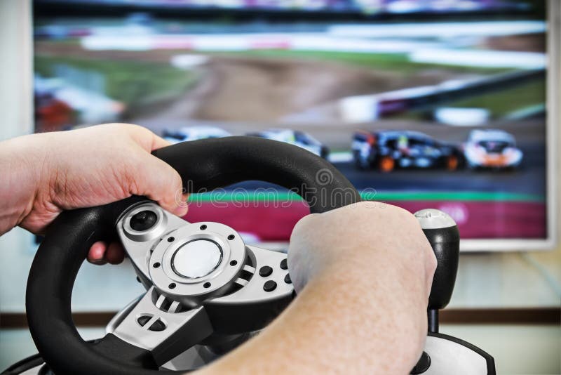 Playing in the Race Behind the Wheel of a Game Console Stock Photo ...