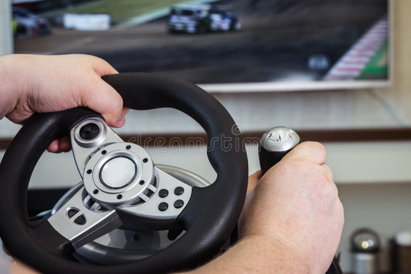 Playing in the Race Behind the Wheel of a Game Console Stock Photo ...