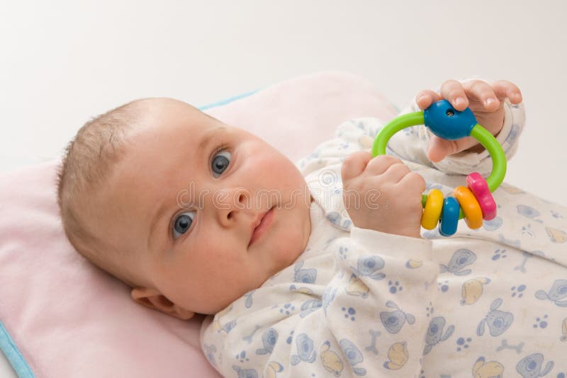 Baby with Rattle stock photo. Image of playing, cute, carefree - 1210386