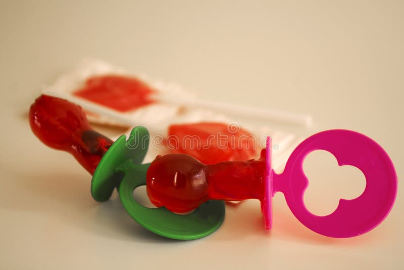 Playing with Lollipops and Caramel Pacifiers Stock Photo - Image of ...