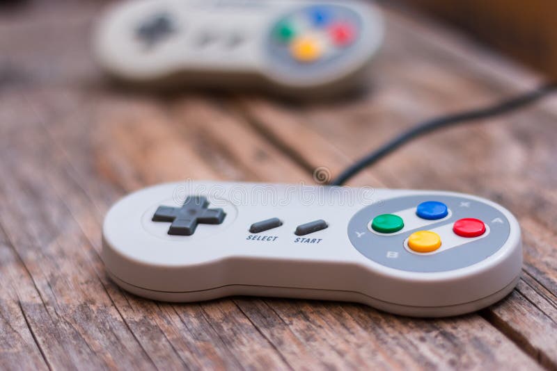 Playing Retro Video Games: Controller on Rustic Wooden Background Stock ...