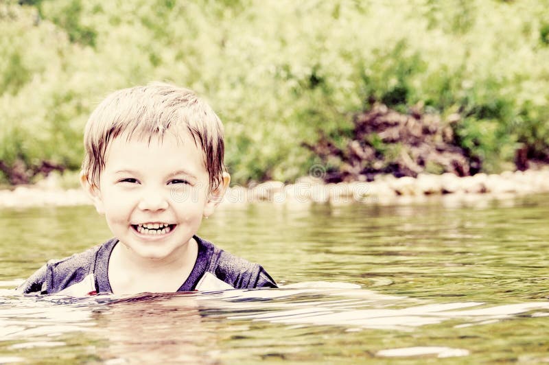 Boy smiling river stock image. Image of river, child - 47610165