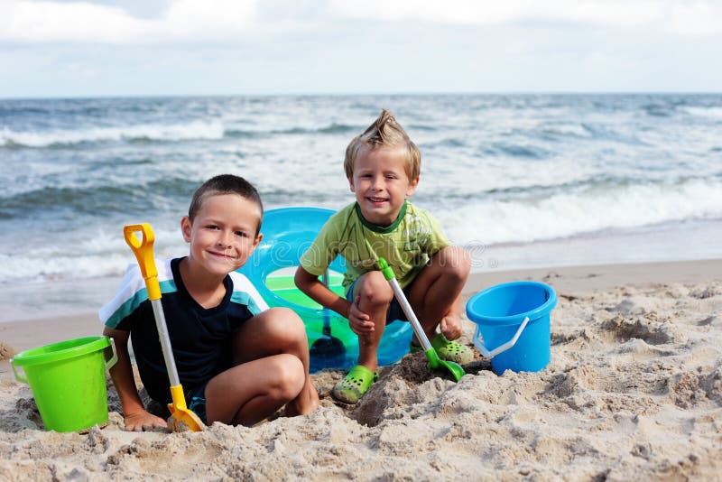 Playing in the sand stock photo. Image of childhood, healthy - 13089166