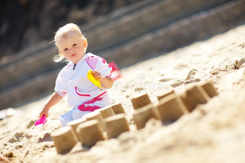 Playing on the sand child stock photo. Image of happy - 32584252