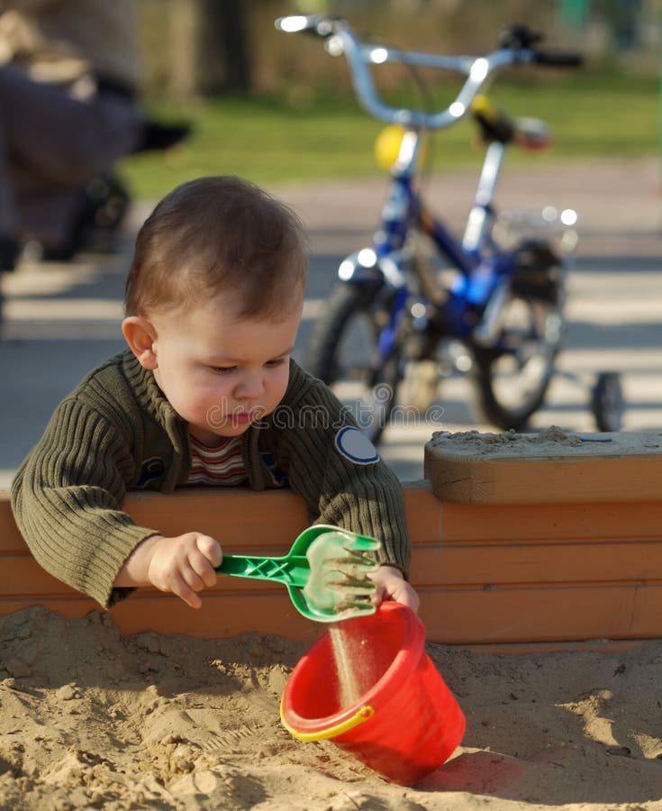 Playing in the sand pit stock image. Image of parent, kindergarten ...