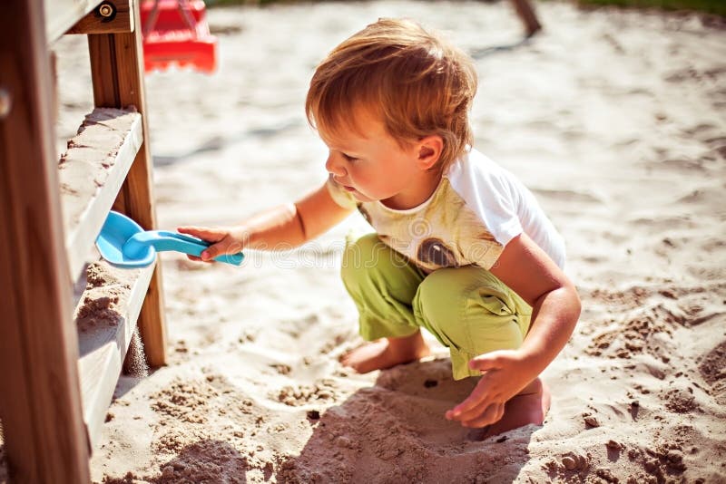Playing with Sand on Playground Stock Image - Image of girl, beautiful ...