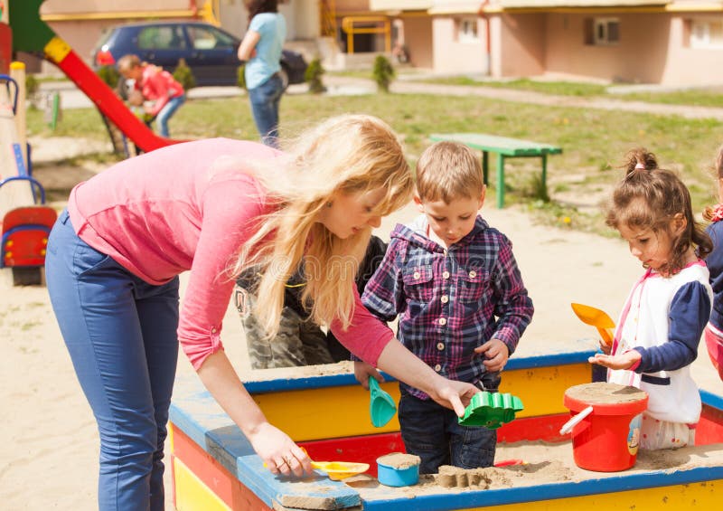 Playing in the sandbox stock image. Image of person, childhood - 54884285