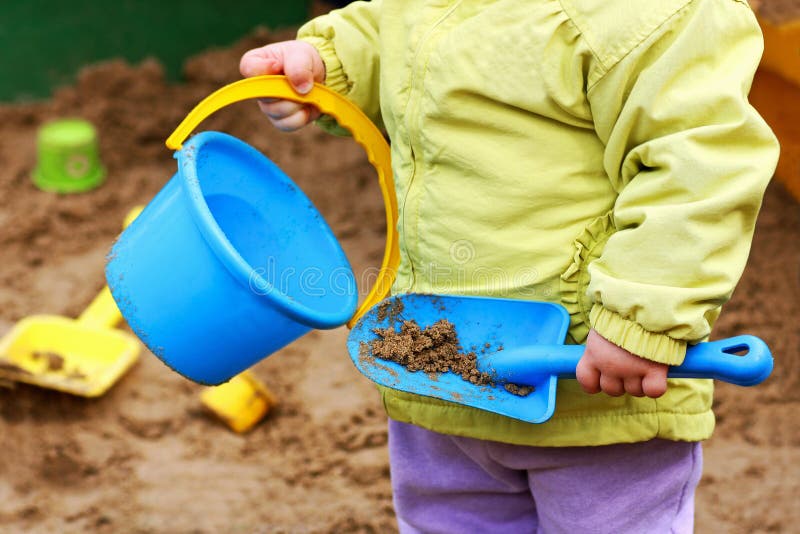 Playing in the sandbox. stock photo. Image of entertainment - 124861994