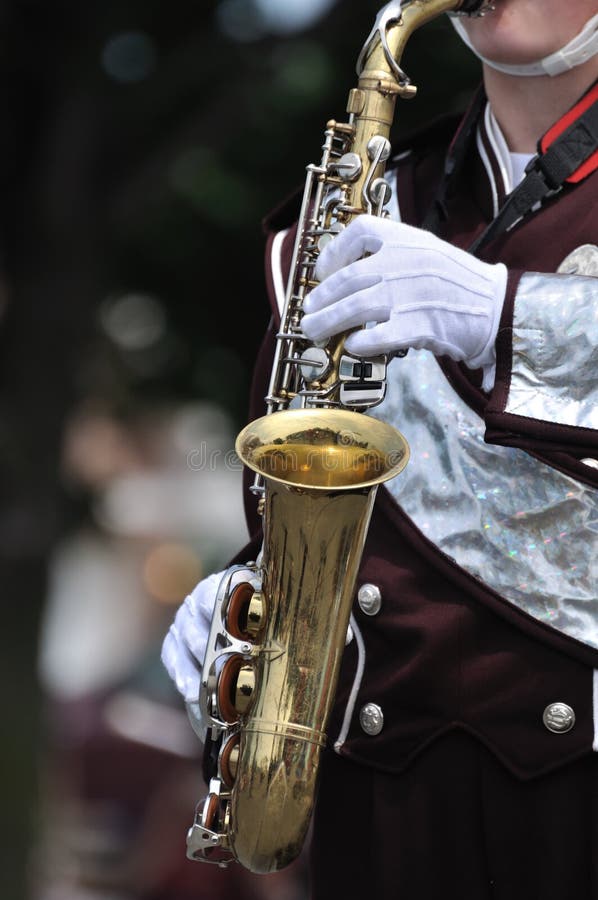 Playing Saxophone in Parade Stock Photo - Image of marching, brass ...