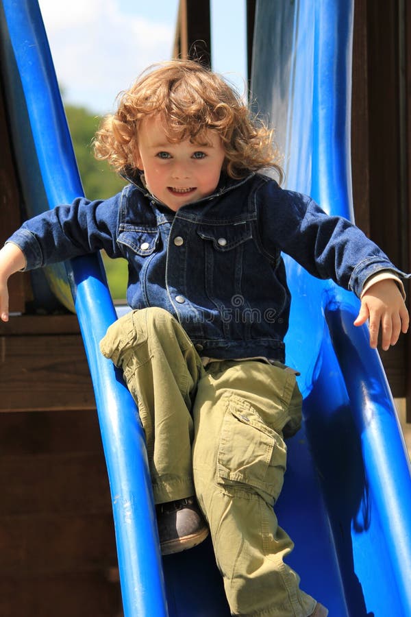 Playing on the slide stock photo. Image of chute, outdoor - 25995406