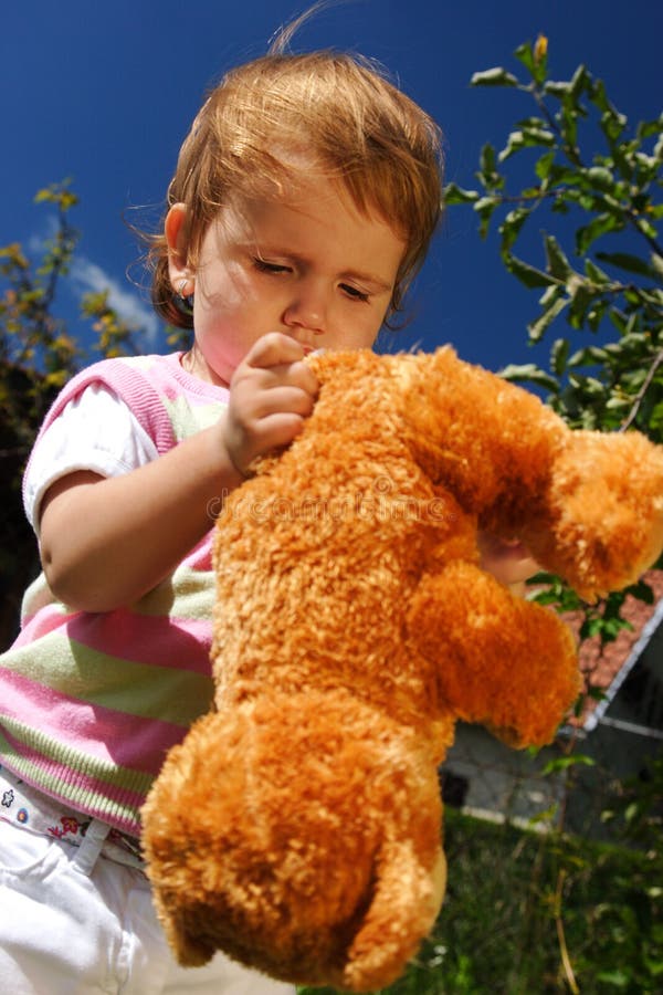 Playing with the Teddy Bear Stock Photo - Image of girl, childhood: 6835802