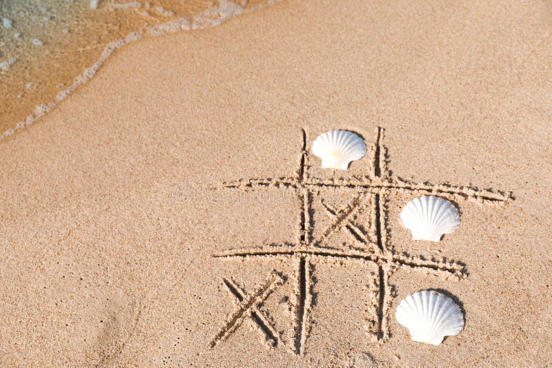 Playing Tic Tac Toe Game with Shells on Sand Near Sea, Above View ...