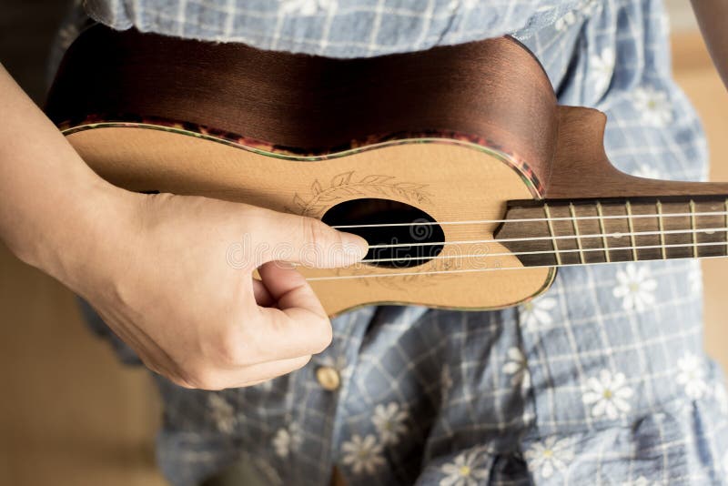 Playing ukulele stock image. Image of hipster, acoustic - 98143653