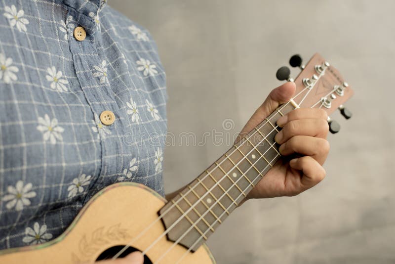 Playing ukulele stock photo. Image of caucasian, busker - 98143718