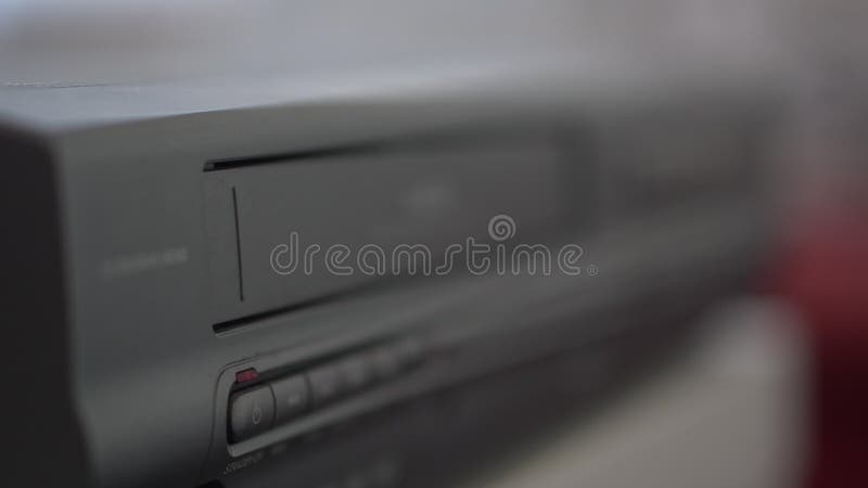 Playing Video Cassette Tape, Inserting in VHS Player and Pressing Play ...