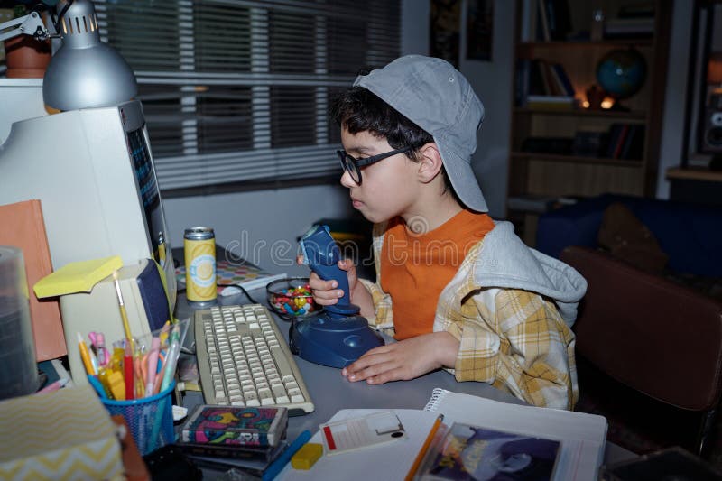 Playing Video Game with Joystick at Computer Desk Stock Photo - Image ...