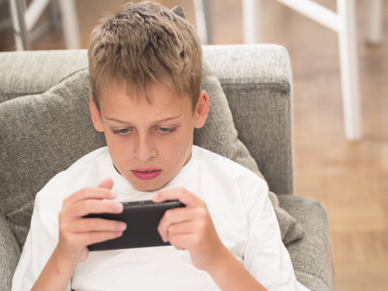 Cute boy with cell phone stock photo. Image of smart - 124877408