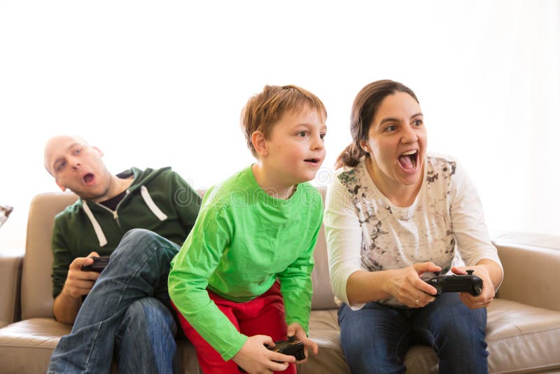 Playing Video Games at Home Stock Photo - Image of parents, parenting ...