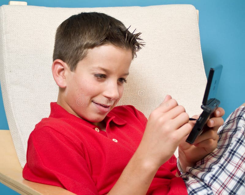 Playing Videogames stock image. Image of device, popular - 5836675