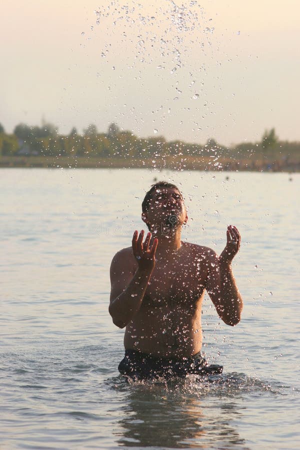 Playing in the water stock photo. Image of warm, young - 1042166