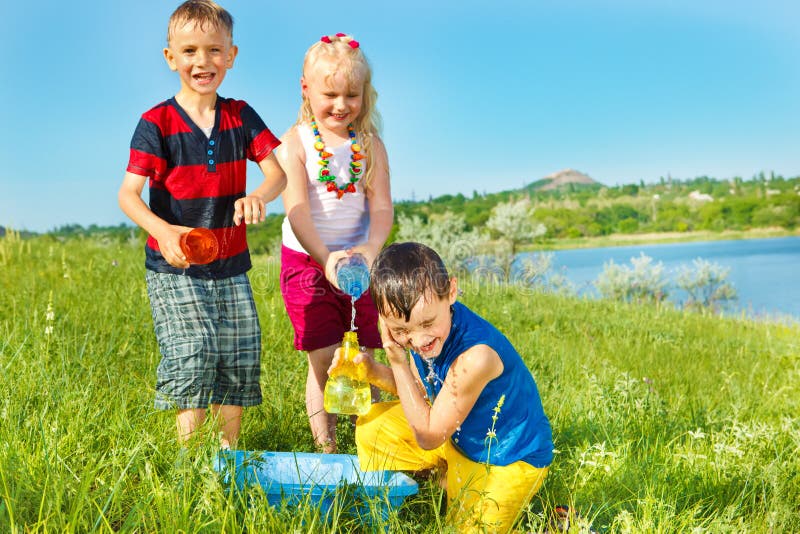 Playing with water stock image. Image of cheerful, interest - 25153537