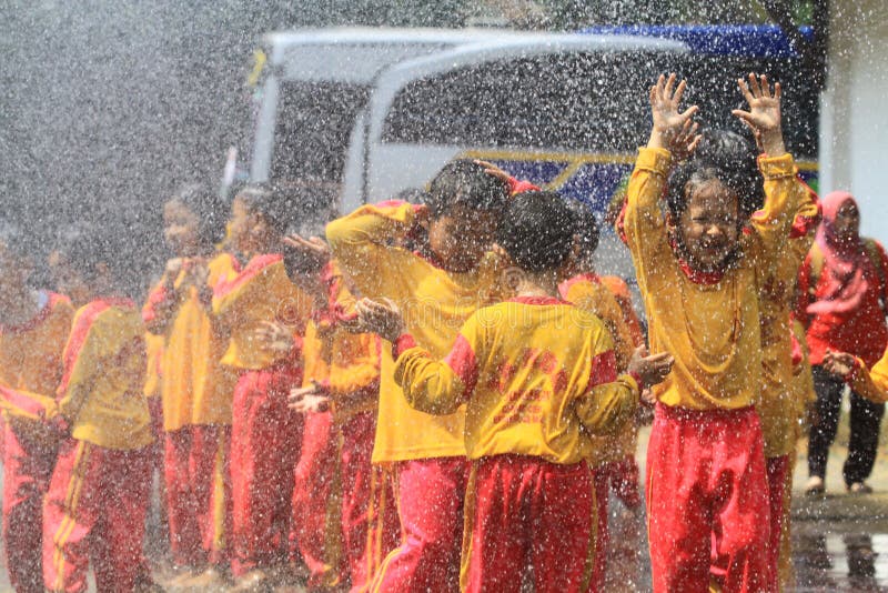 Playing Water Spray Fire editorial stock image. Image of activities ...