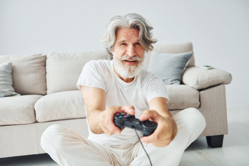 Plays Video Game by Using Controller. Senior Stylish Modern Man with ...