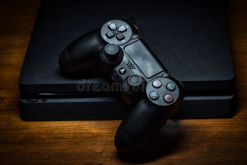 PlayStation Sitting on Top of a Wood Table Editorial Stock Image ...