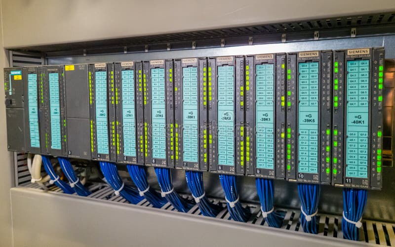 PLC Modules in a Row in Electrical Cabinet of Automation Control System ... PLC Modules in a Row in Electrical Cabinet of Automation Control System ...