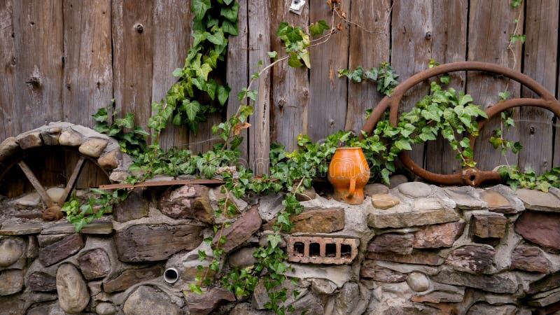 Pld Pots, Wheels and Traditional Things Lying Next To Long Wooden Fence ... Pld Pots, Wheels and Traditional Things Lying Next To Long Wooden Fence ...
